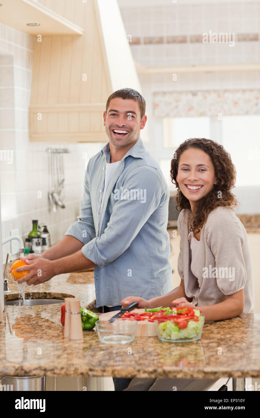 Handsome man cooking with his girlfriend Stock Photo - Alamy