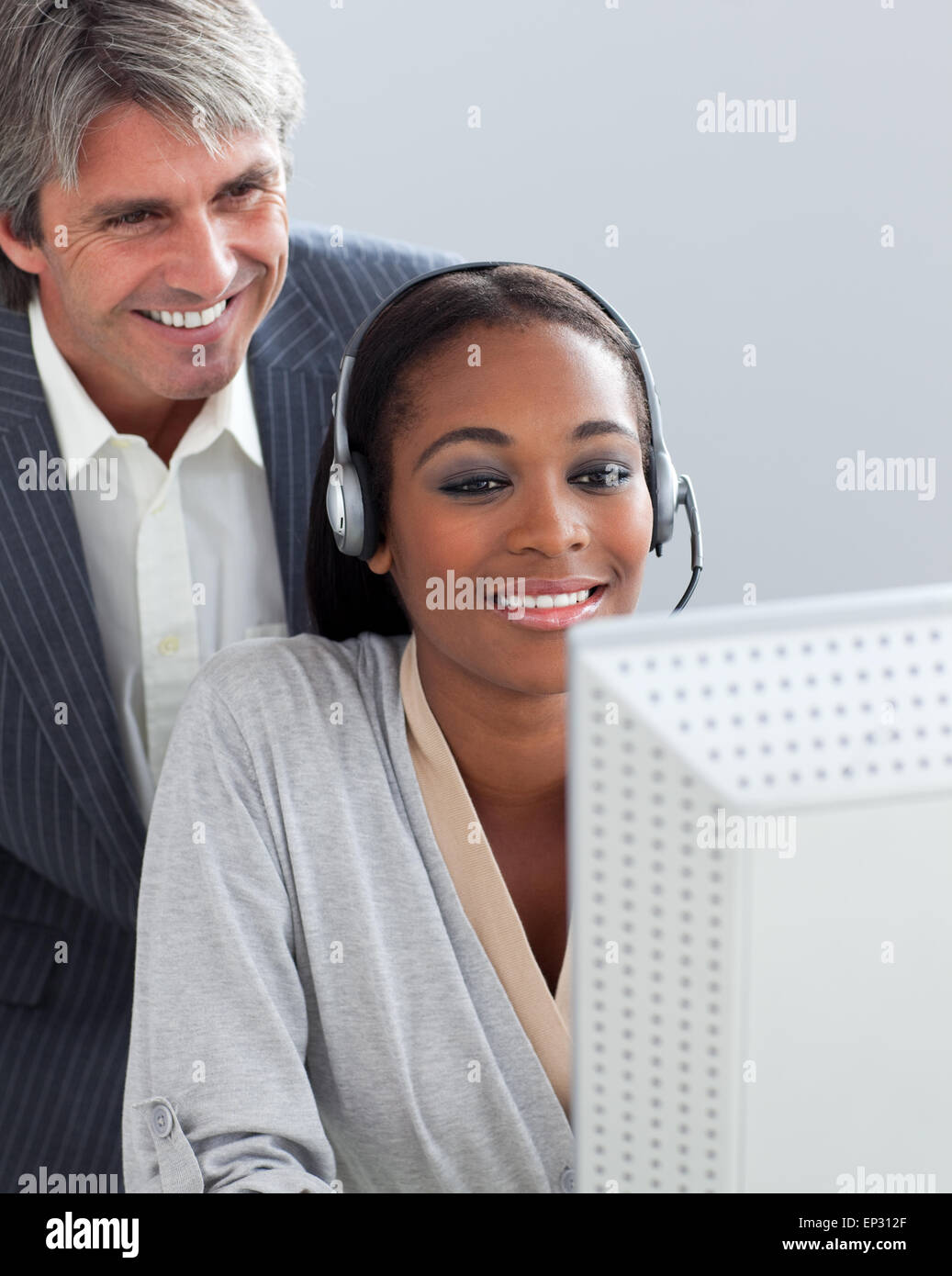 Smiling manager checking his employee's work Stock Photo - Alamy