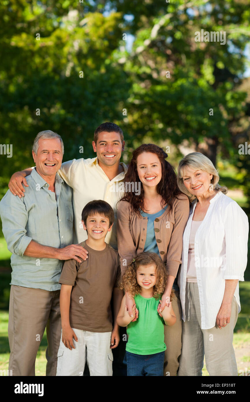 Family looking at the camera in the park Stock Photo - Alamy