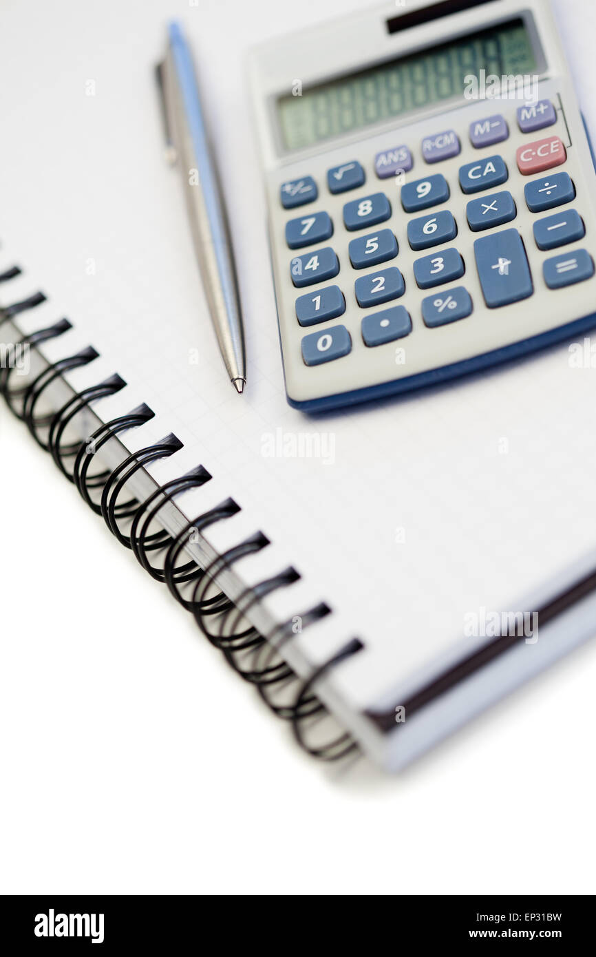 Angled notebook with pencil and pocket calculator Stock Photo - Alamy