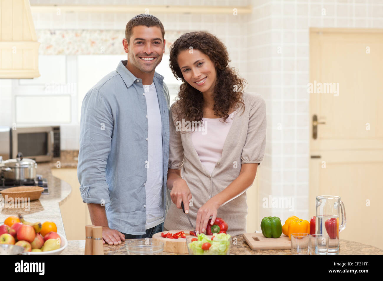 Handsome man cooking with his girlfriend Stock Photo - Alamy