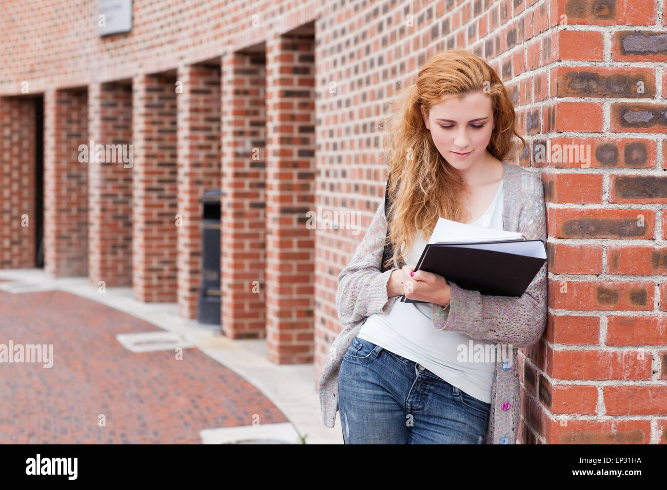 Young student reading her notes Stock Photo - Alamy
