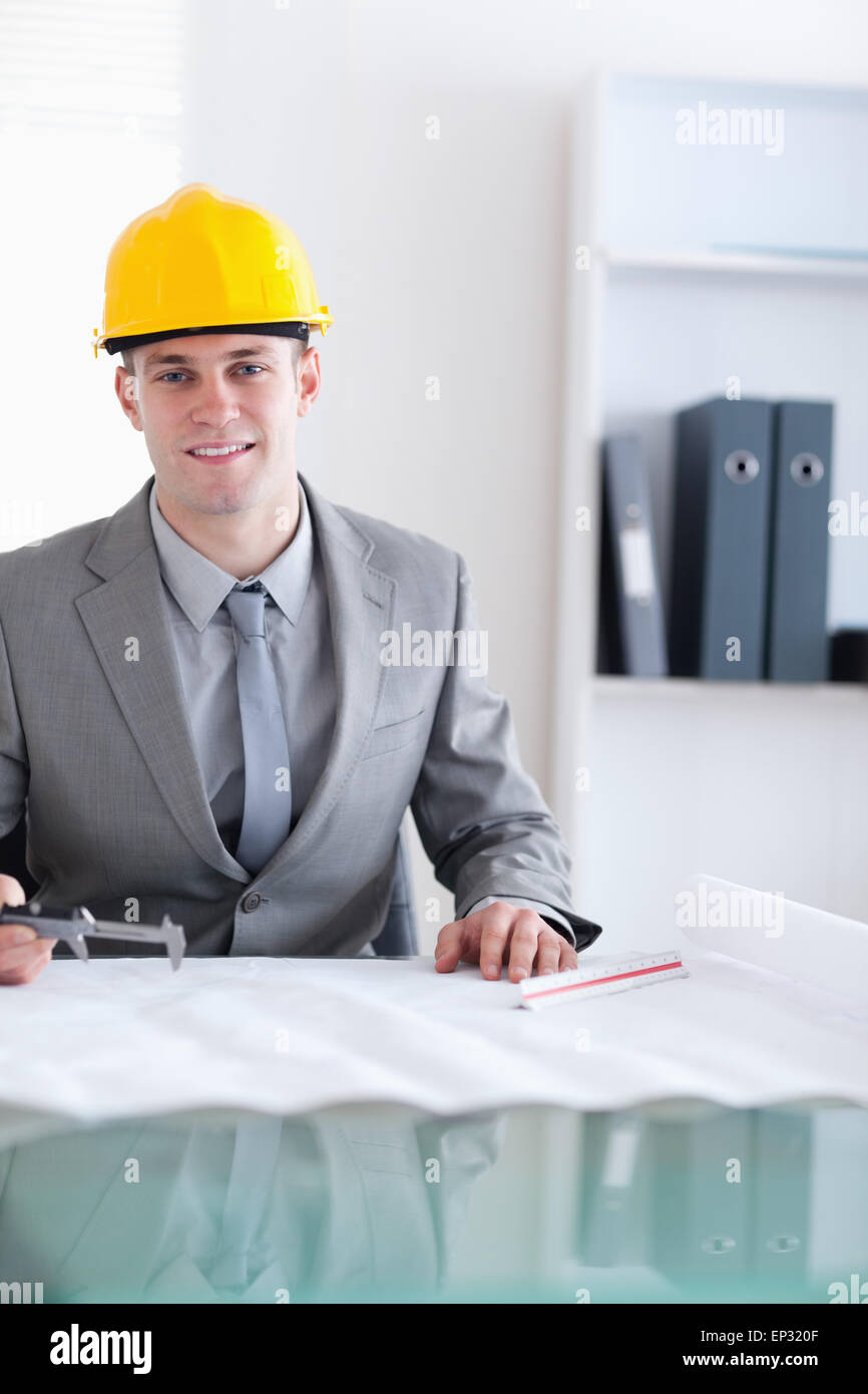 Close up of smiling architect working on a plan Stock Photo - Alamy