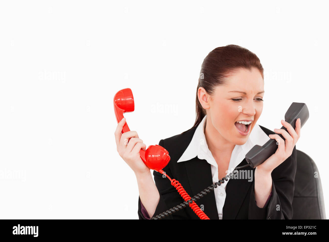 Cute secretary driven crazy by the phone calls Stock Photo - Alamy