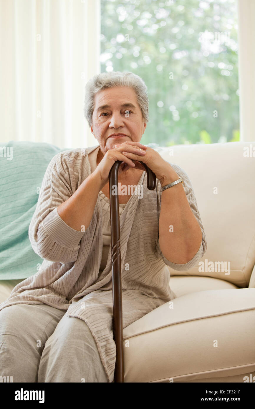 Senior woman with her walking stick Stock Photo - Alamy