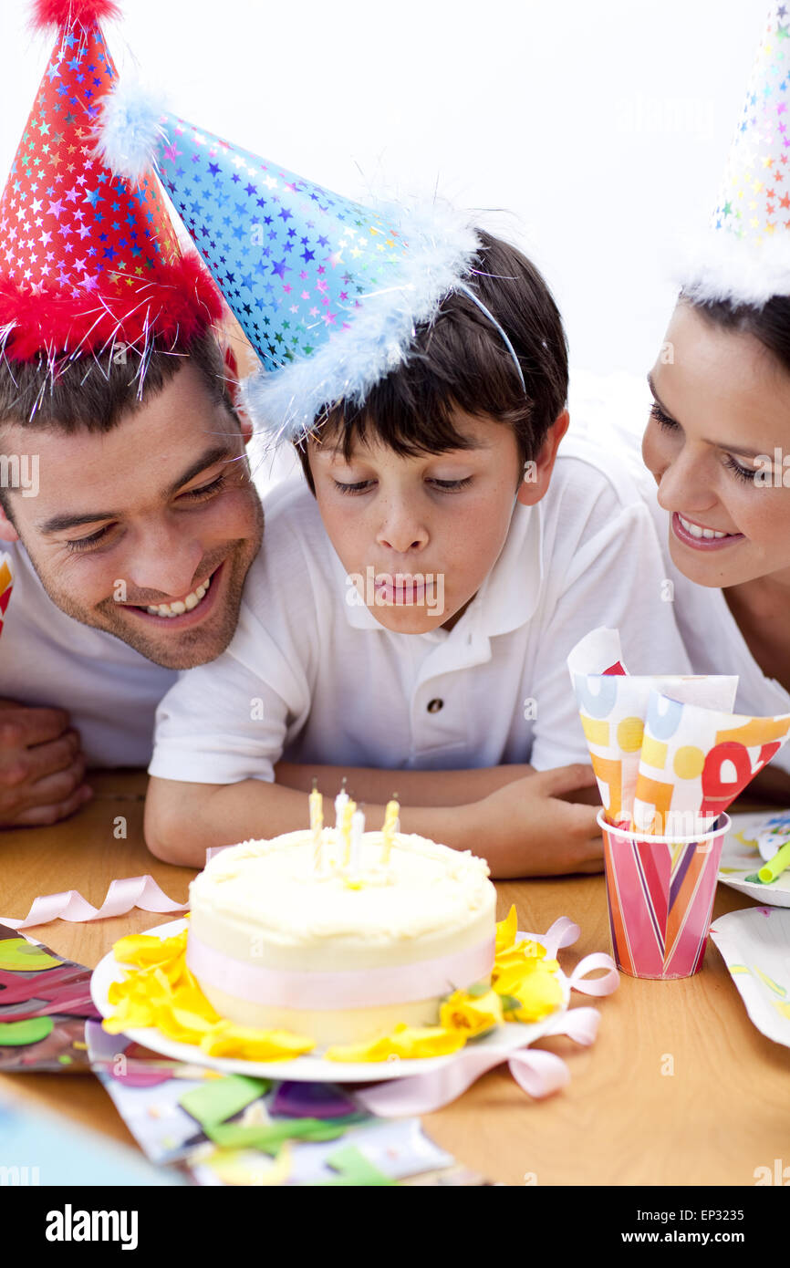 Little boy celebrating his birthday with his parents Stock Photo - Alamy