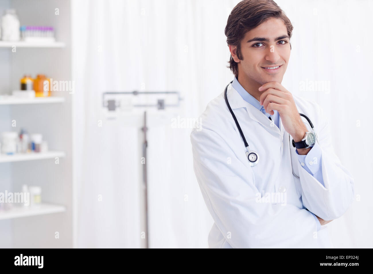 Doctor standing in his examination room Stock Photo - Alamy