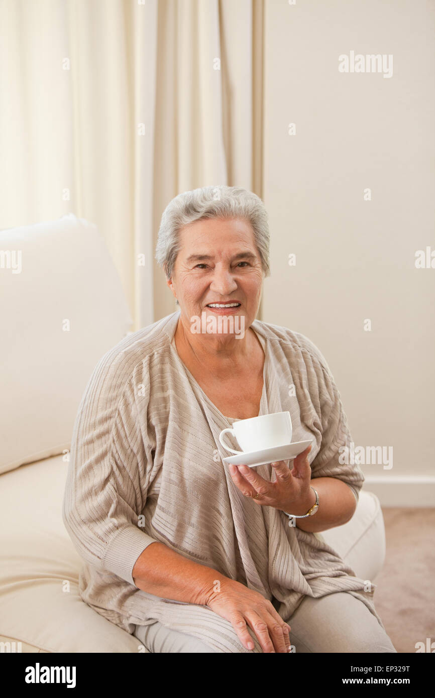 Mature woman drinking some tea Stock Photo - Alamy