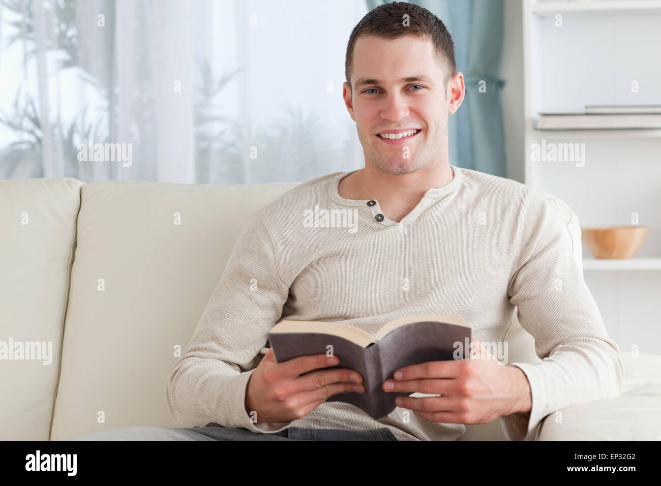 Man holding a book Stock Photo - Alamy