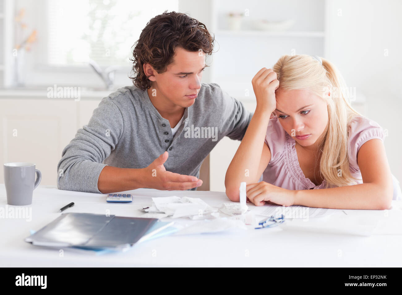Arguing couple at a table Stock Photo - Alamy