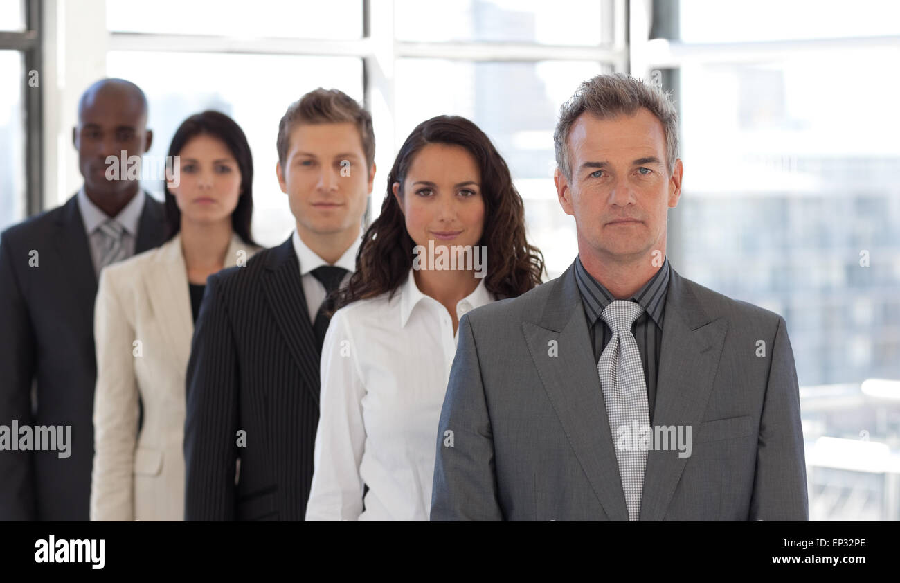 Five Person Business team standing being Serious Stock Photo - Alamy
