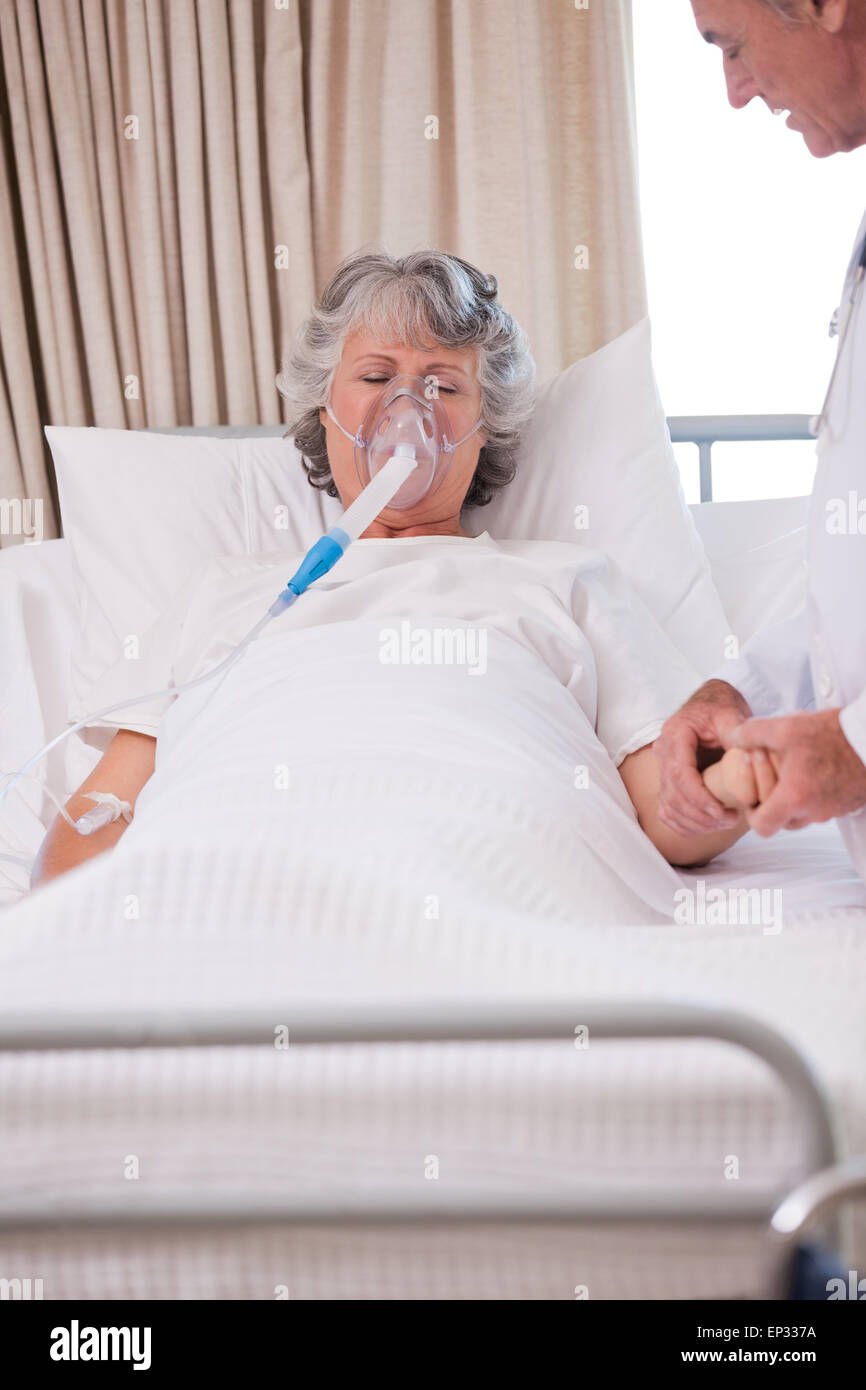 Senior doctor with his sick patient Stock Photo - Alamy