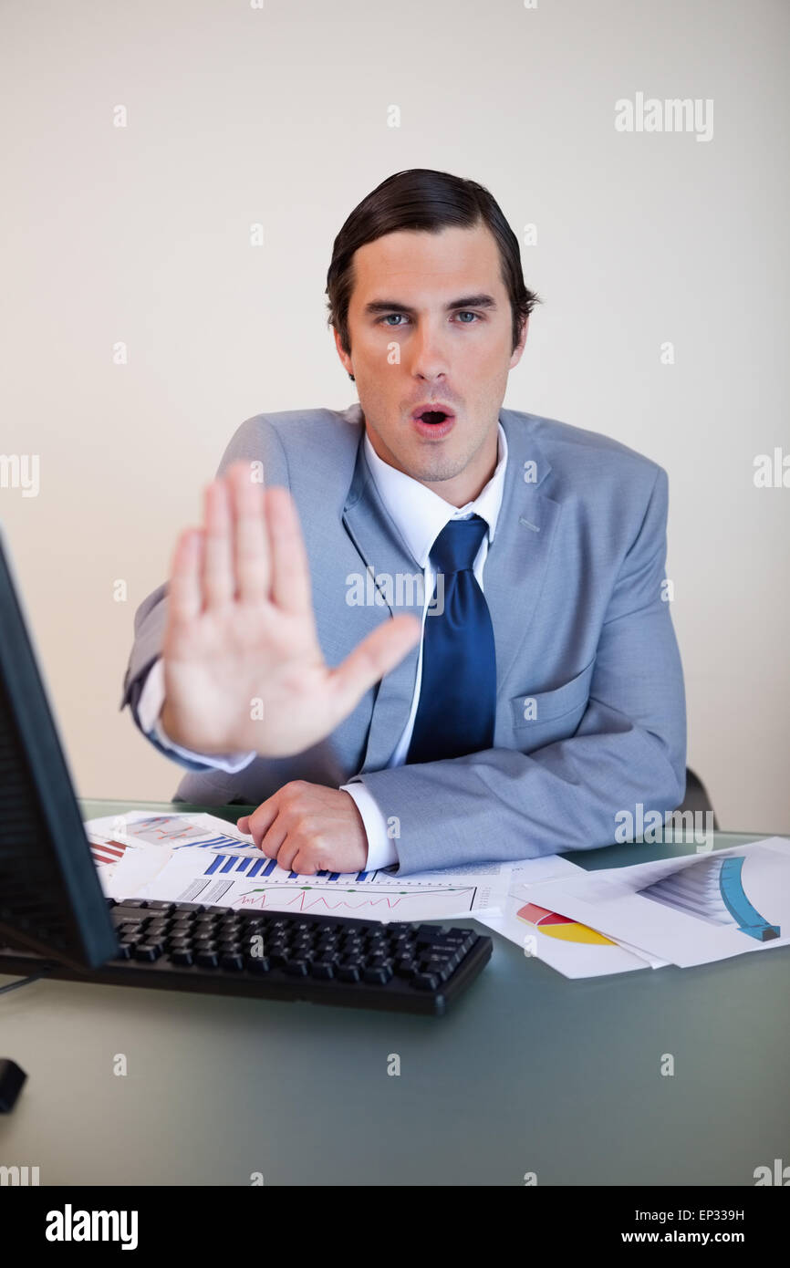 Businessman trying to calm down his negotiation partner Stock Photo - Alamy