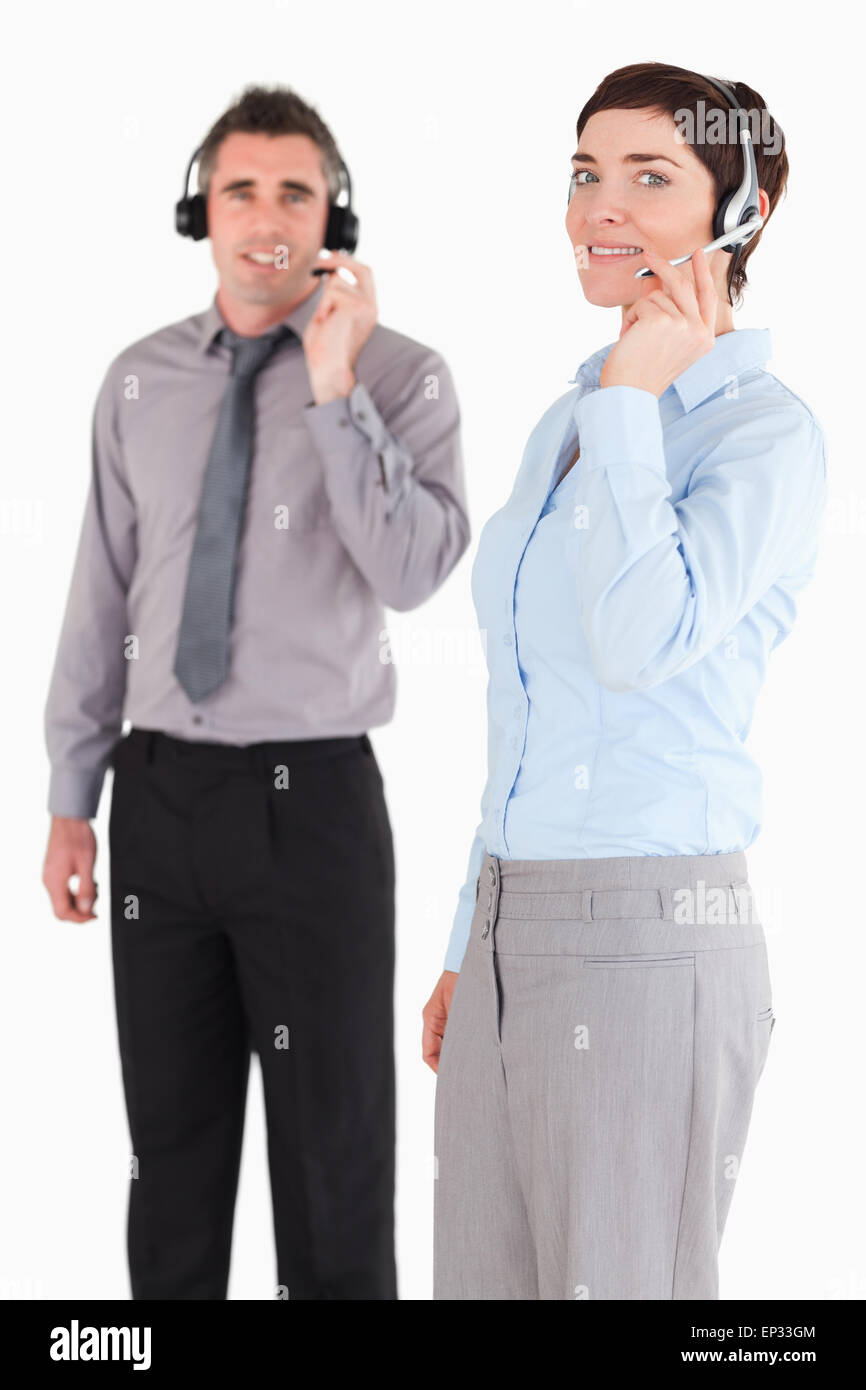 Portrait of managers speaking through headsets Stock Photo - Alamy