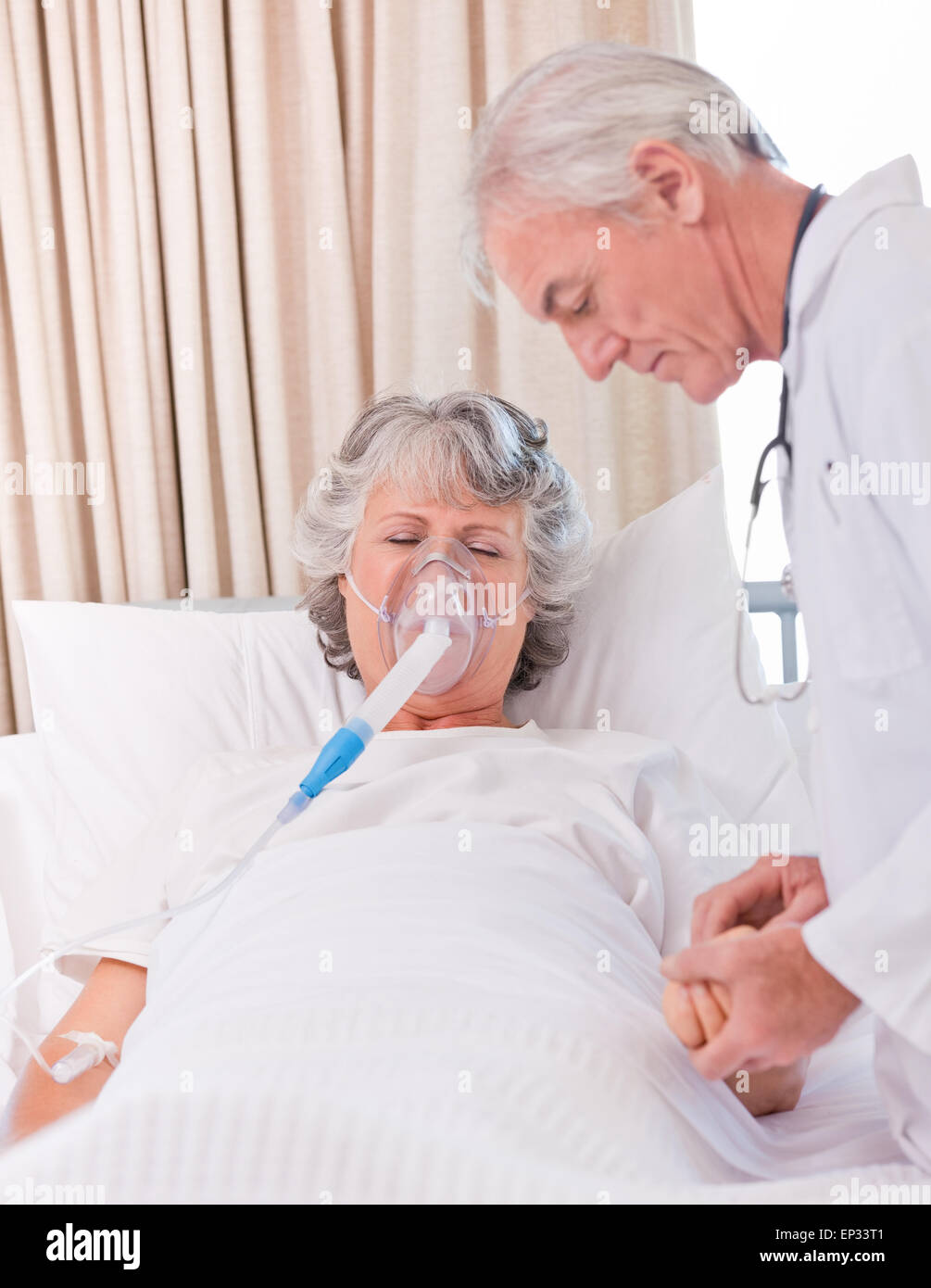 Senior doctor with his sick patient Stock Photo - Alamy