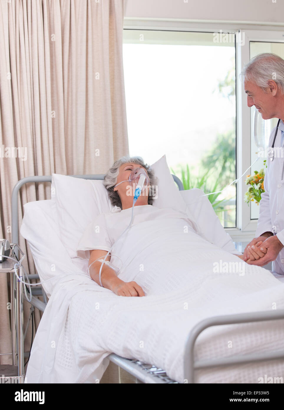 Senior doctor with his sick patient Stock Photo - Alamy