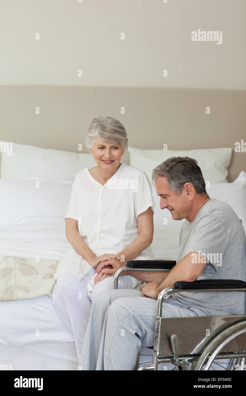 Mature couple in their bedroom Stock Photo - Alamy