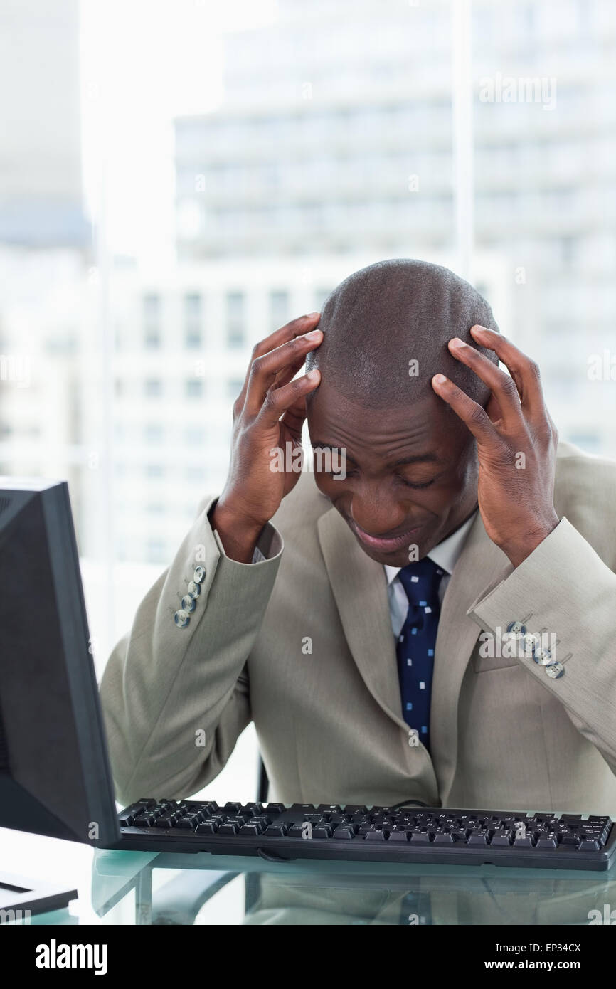 Portrait of a tired office worker using a computer Stock Photo - Alamy