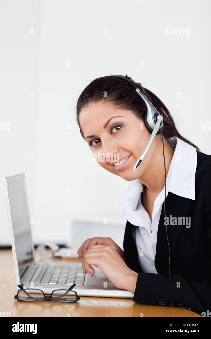 A smiling young operator in her office Stock Photo - Alamy