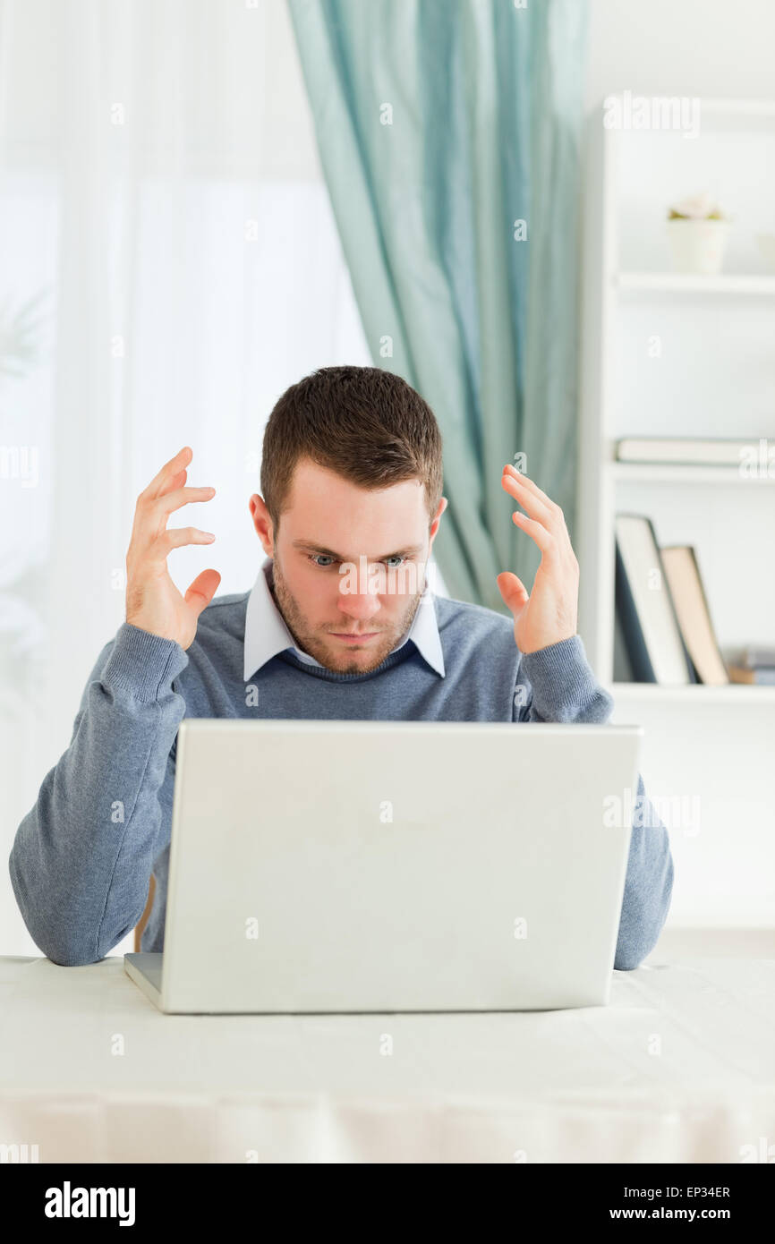 Businessman having problems with his laptop in his homeoffice Stock ...
