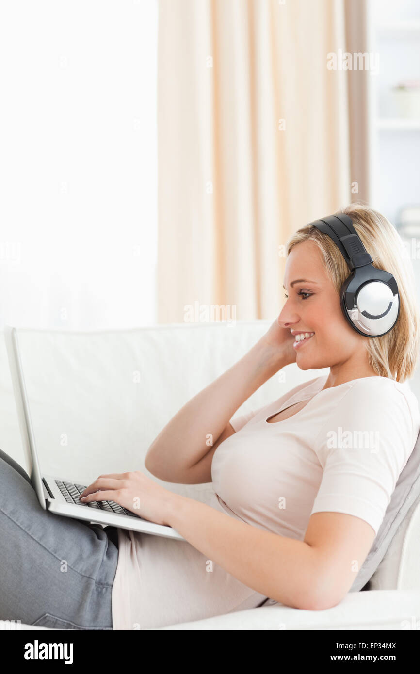 Portrait of a woman watching a movie with her laptop Stock Photo - Alamy