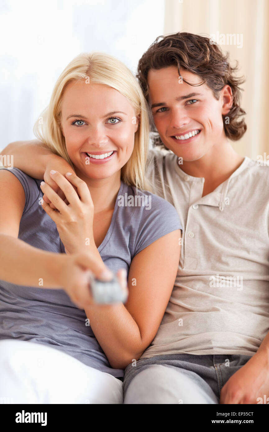 Portrait of a lovey couple watching TV Stock Photo - Alamy