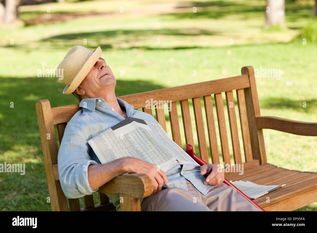 Senior man sleeping on the bench Stock Photo - Alamy