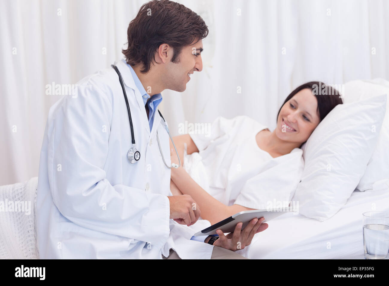Doctor telling his patient the good news Stock Photo - Alamy