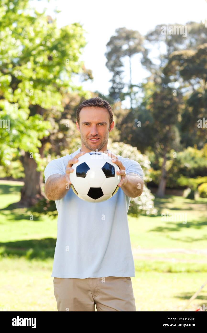 Handsome man with a ball Stock Photo - Alamy