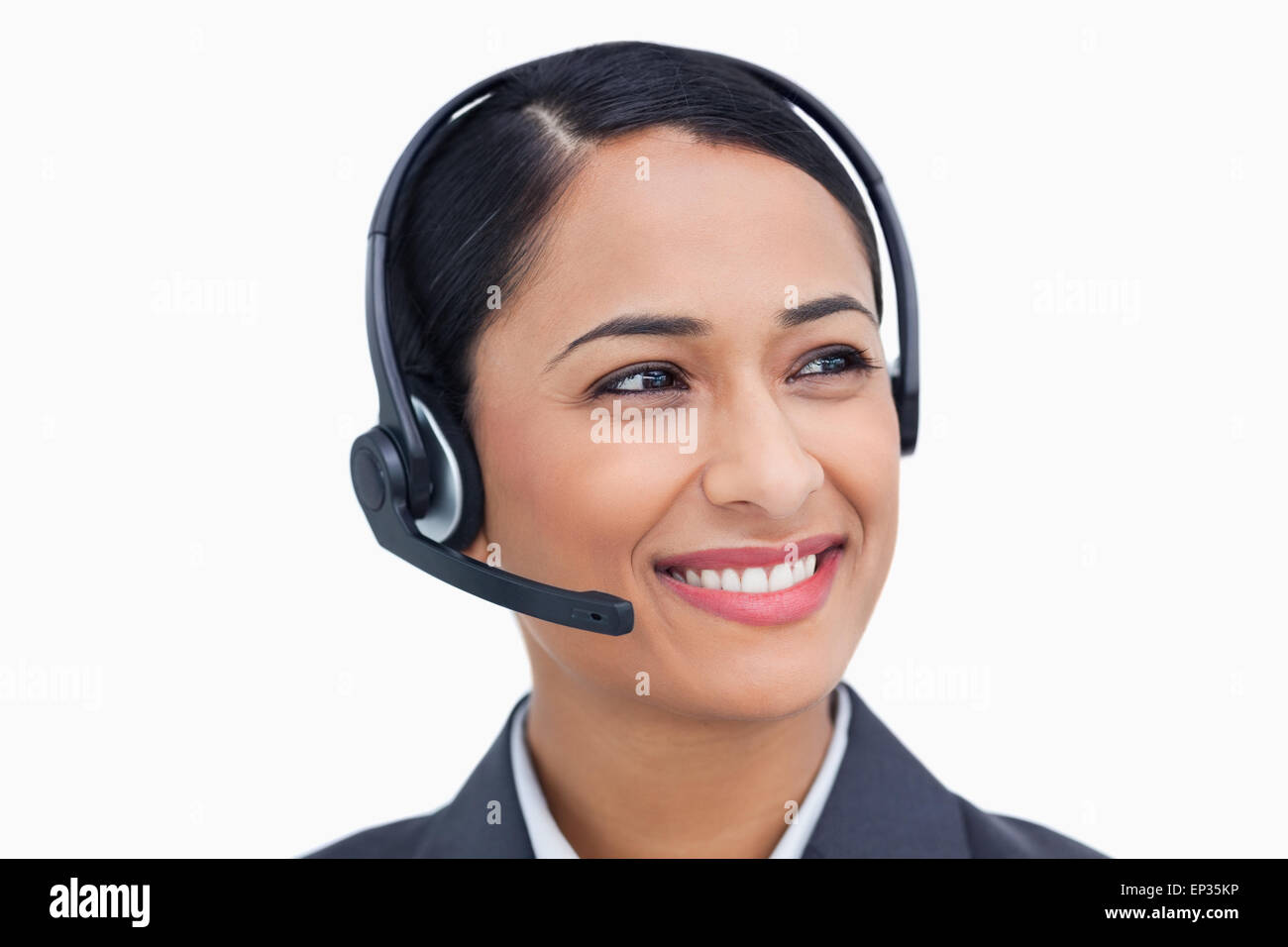 Close up of smiling call center agent looking to the side Stock Photo ...