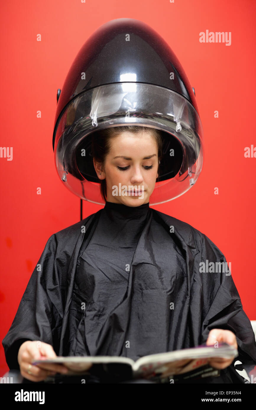 Portrait of a woman under a hairdressing machine Stock Photo - Alamy