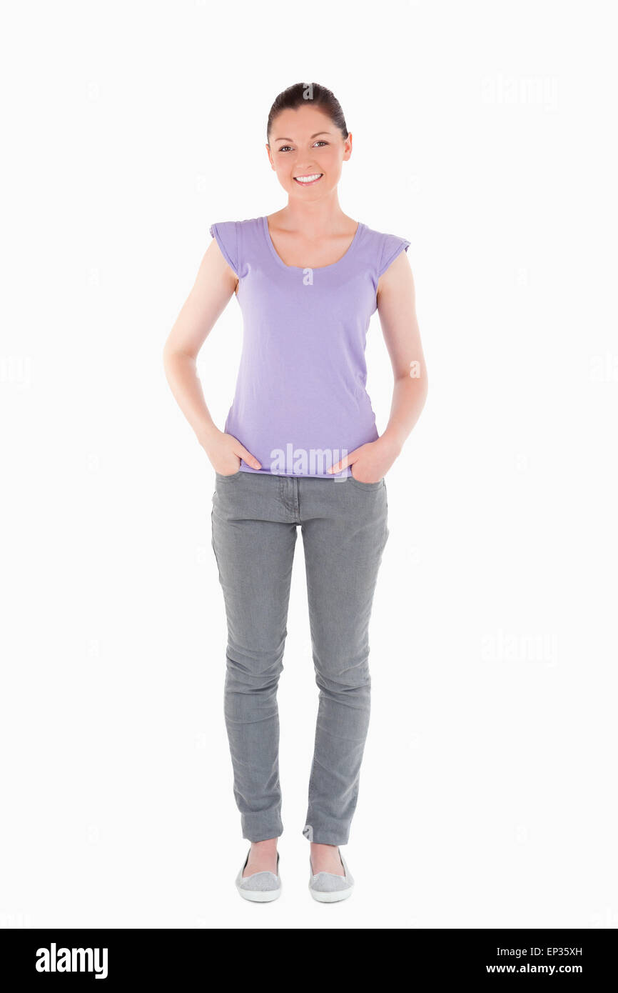 Pretty woman posing while standing Stock Photo - Alamy
