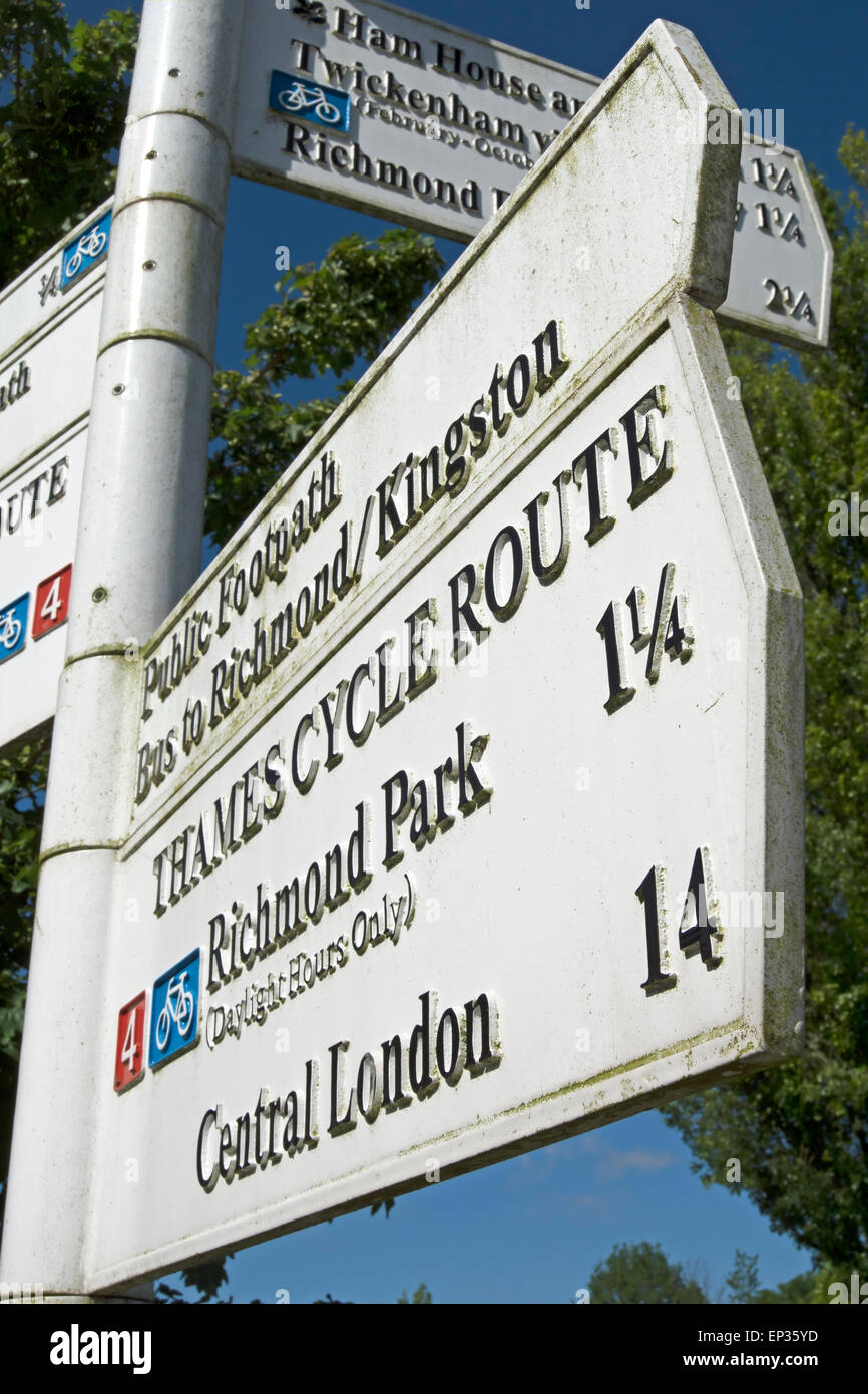 signpost showing thames cycle route and distance to richmond park and ...
