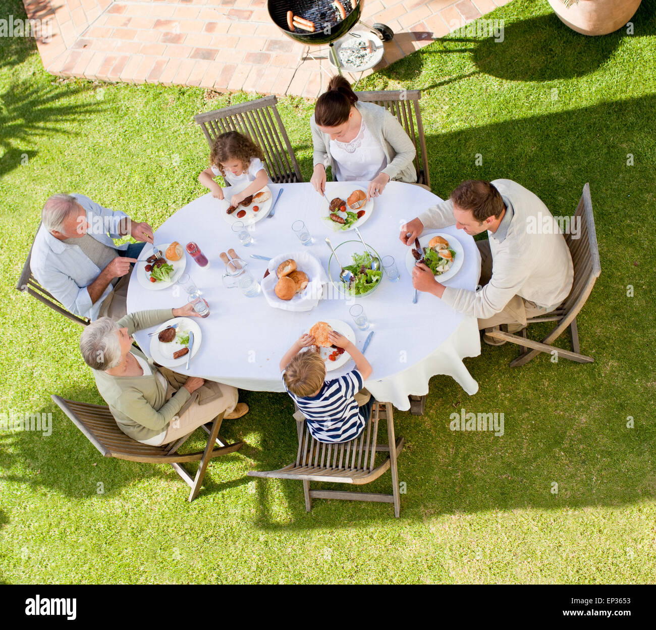 Family eating in the garden Stock Photo - Alamy