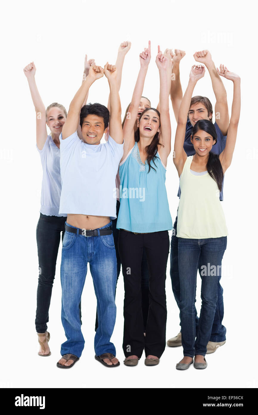 People smiling together and raising their arms Stock Photo - Alamy