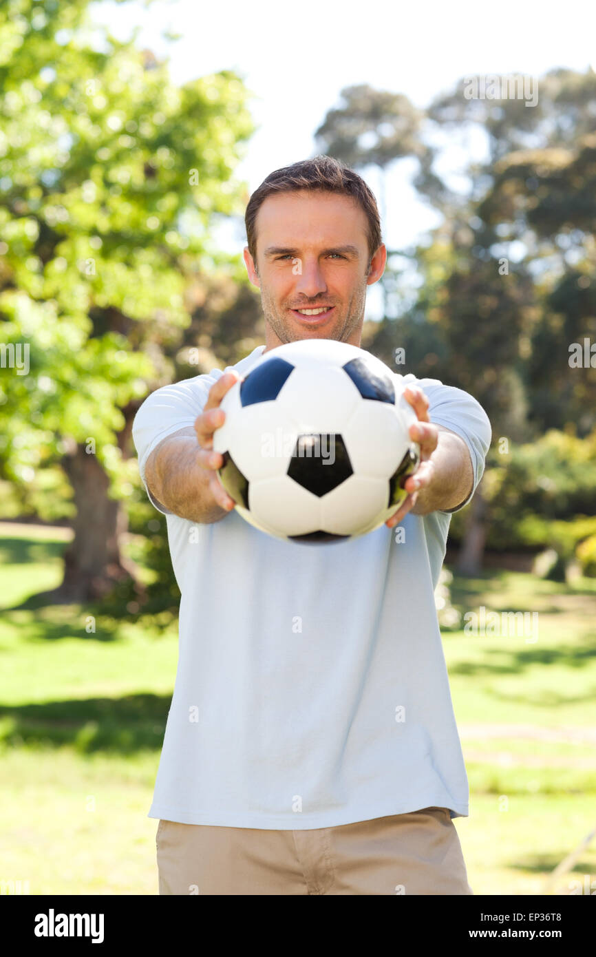 Handsome man with a ball Stock Photo - Alamy