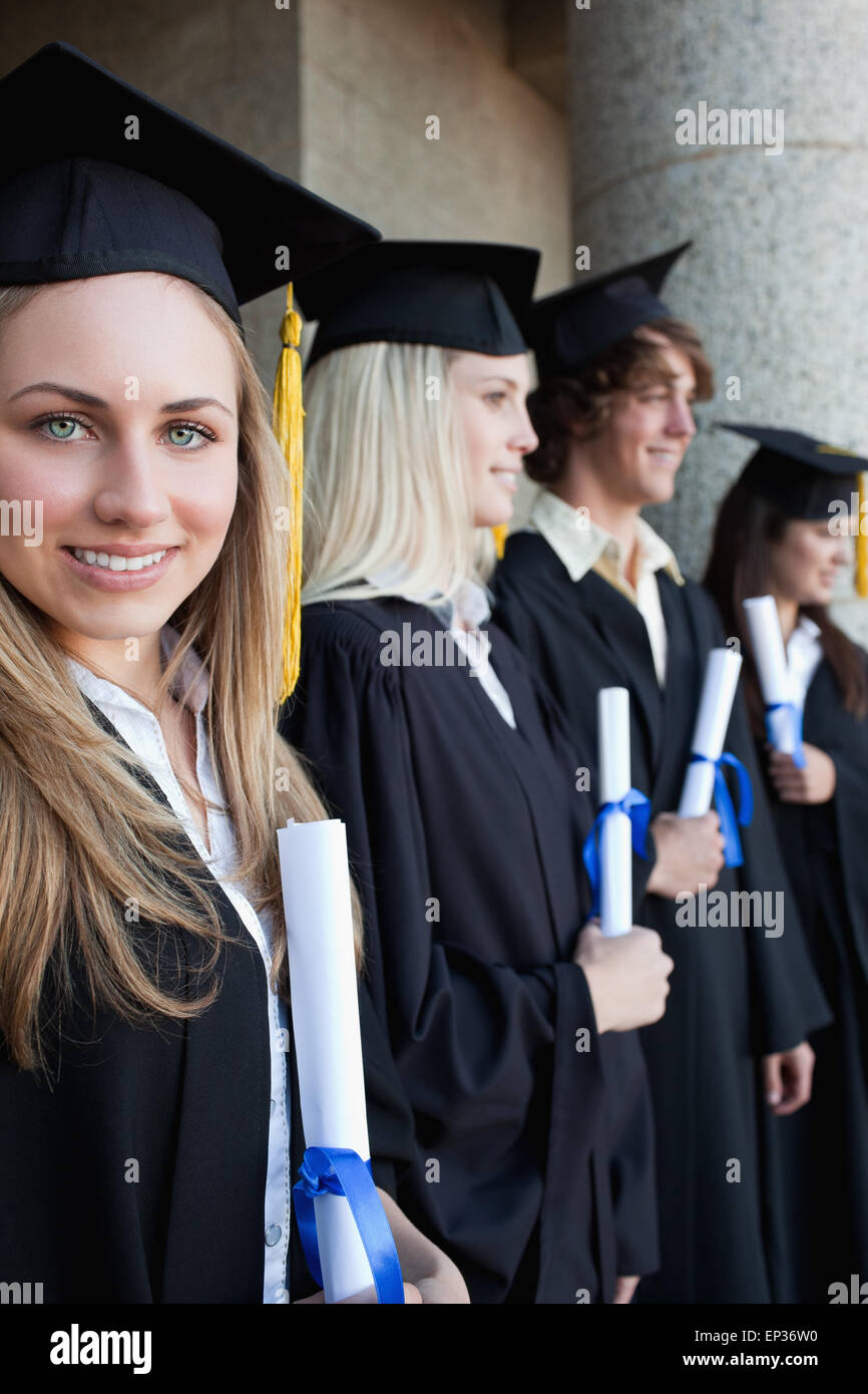 Portrait of a blonde graduate with blue eyes Stock Photo - Alamy