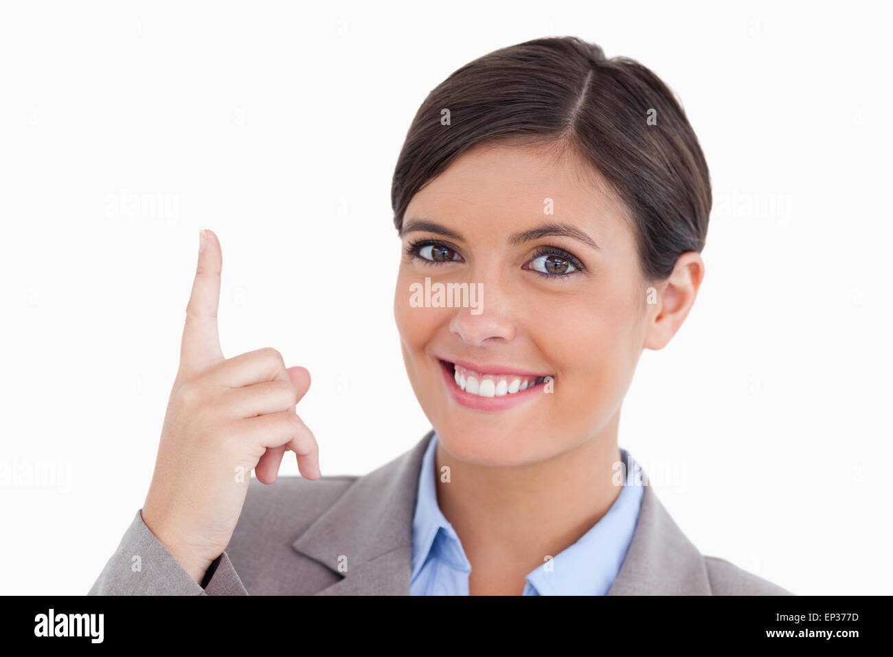 Close up of smiling female entrepreneur pointing up Stock Photo - Alamy