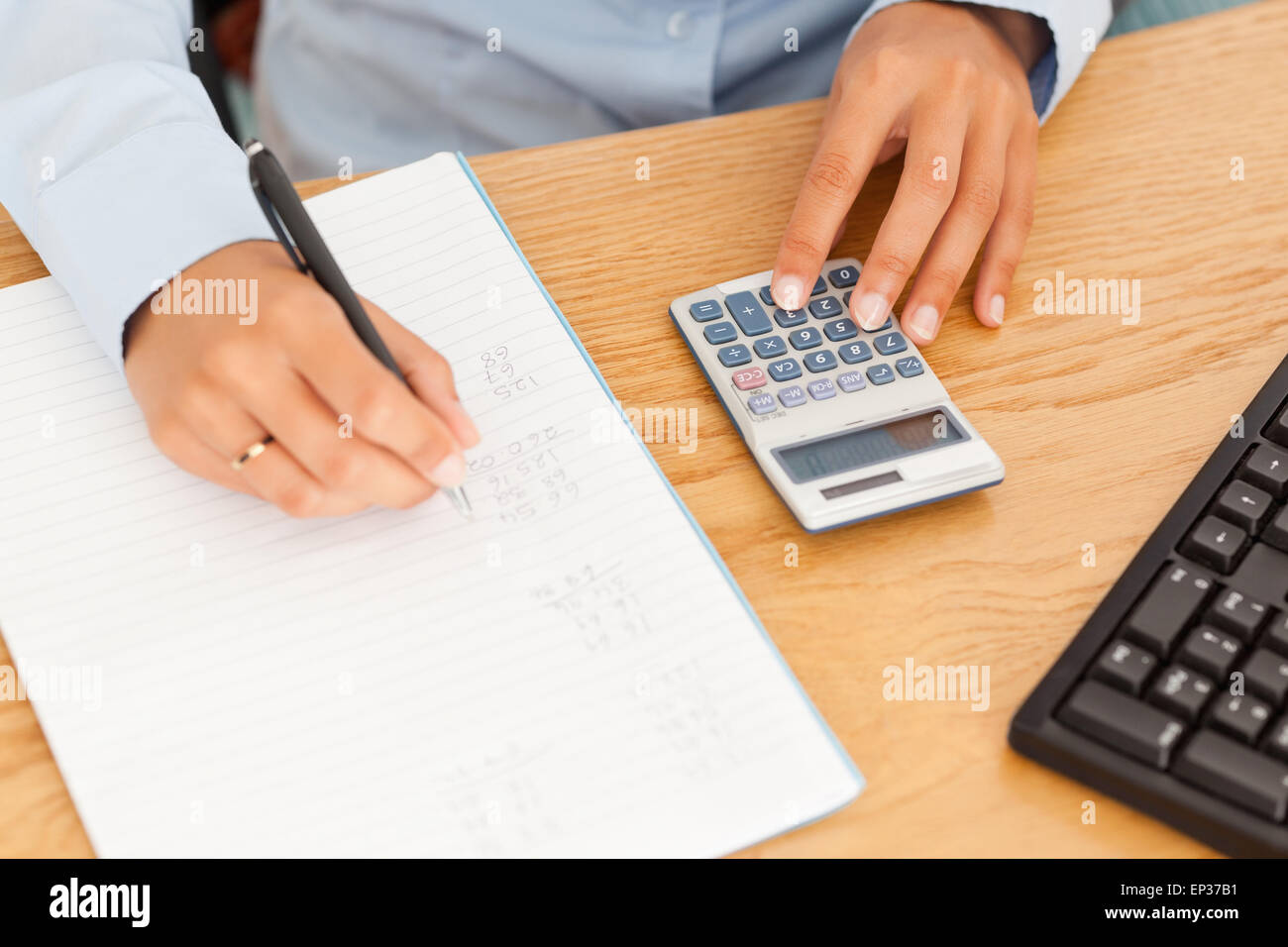 Hands of an accountant making a report Stock Photo - Alamy