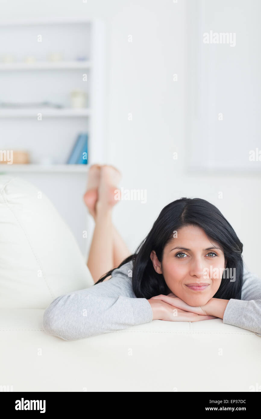 Woman with her head resting on her crossed arms Stock Photo - Alamy