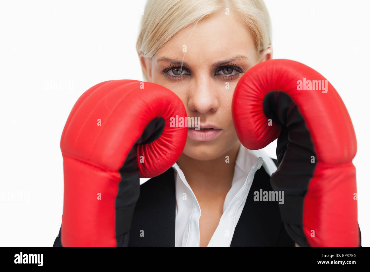 Serious blonde woman with red gloves fighting Stock Photo - Alamy