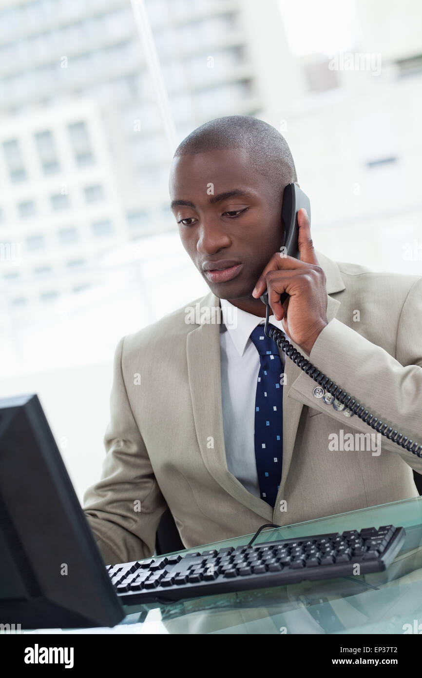 Portrait of an office worker making a phone call Stock Photo - Alamy