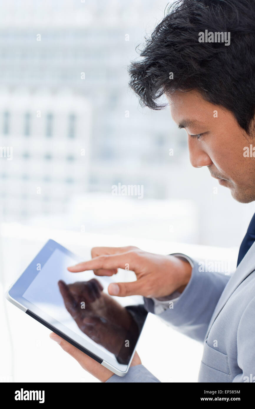 Portrait of a young office worker using a tablet computer Stock Photo ...