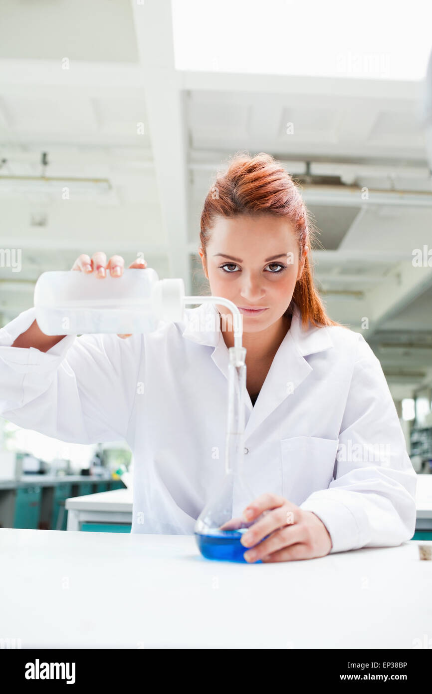 Portrait of a cute science student doing an experiment Stock Photo - Alamy