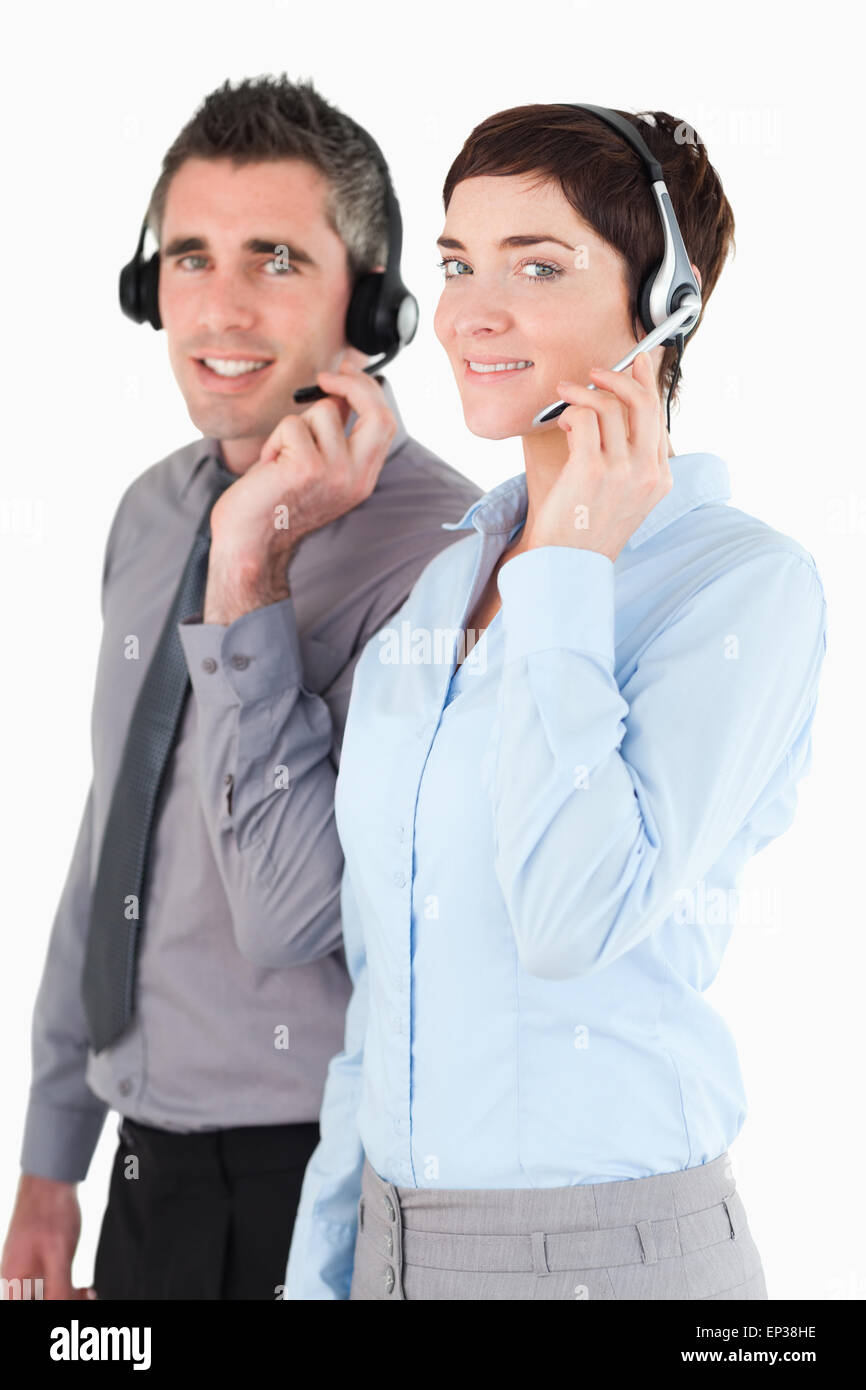 Portrait of operators speaking through headsets Stock Photo - Alamy