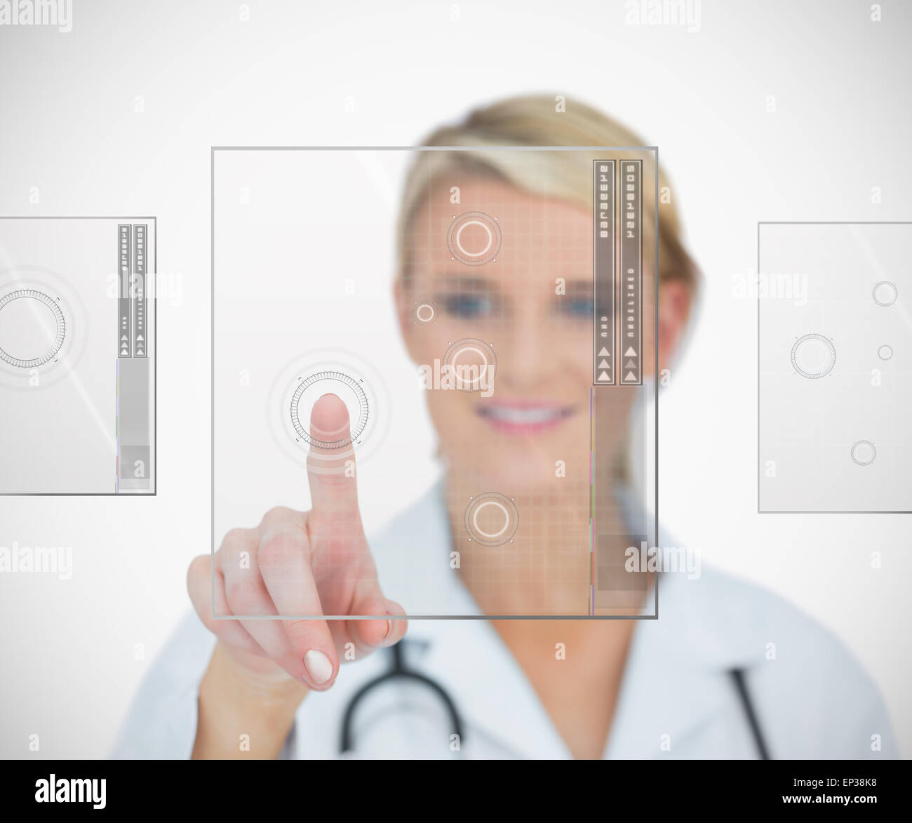 Doctor standing smiling while pressing on interface Stock Photo - Alamy