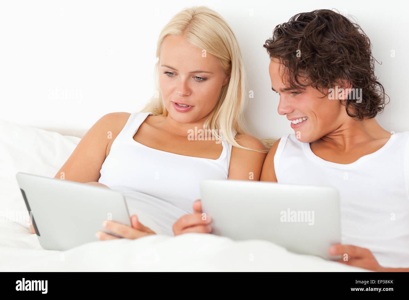 Man and women using tab hi-res stock photography and images - Alamy
