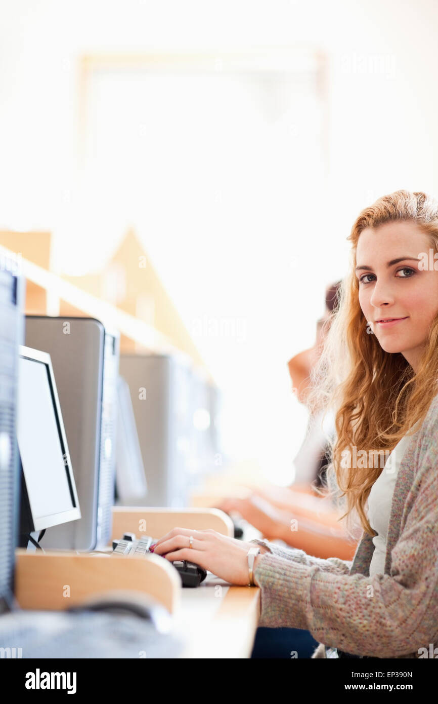 Portrait of a student posing with a computer Stock Photo - Alamy