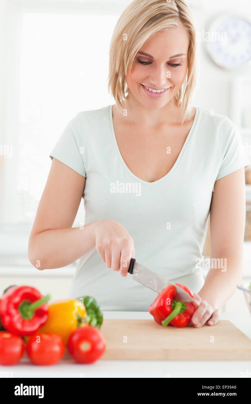Woman cutting peppers Stock Photo - Alamy