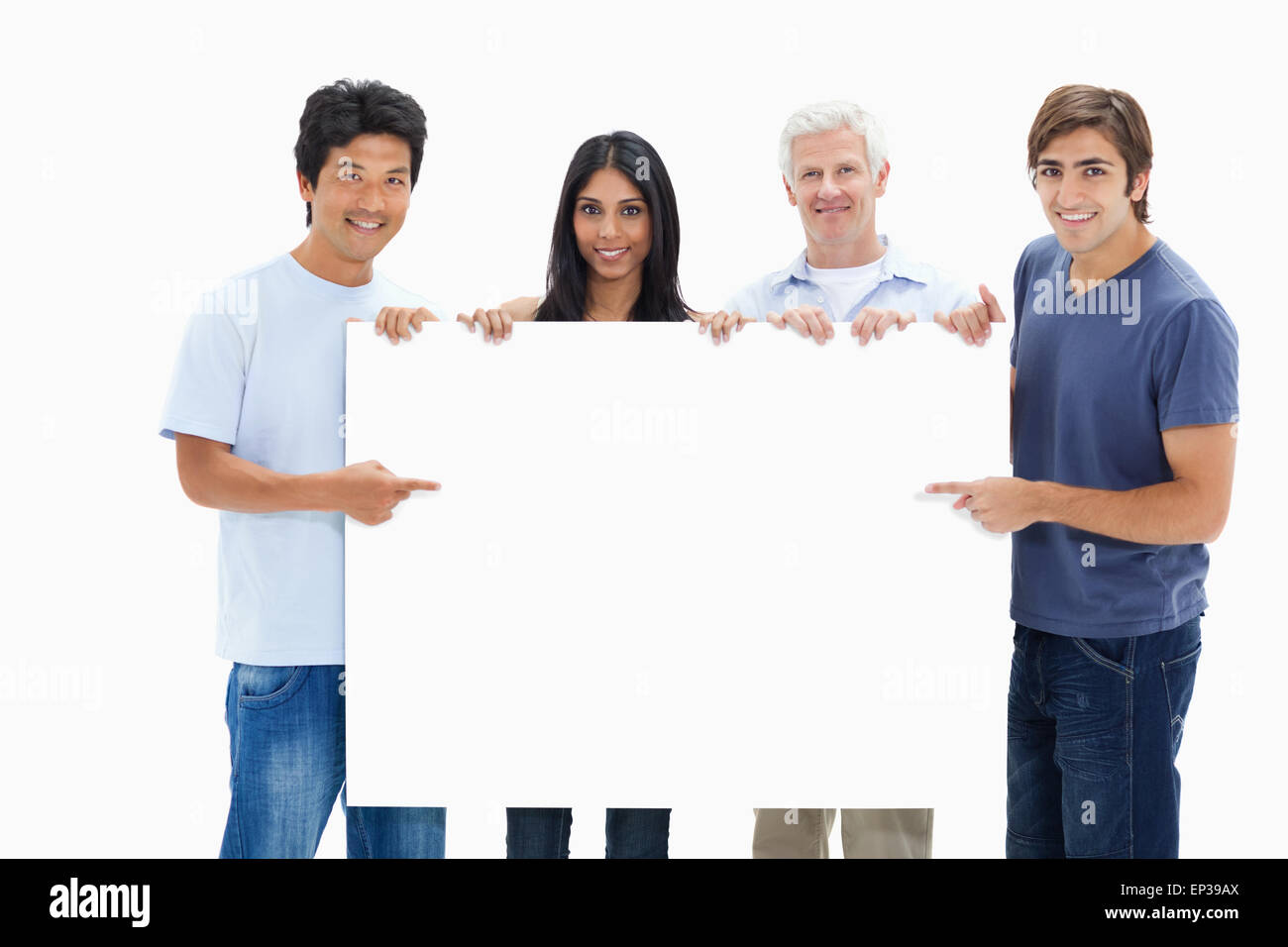 People in jeans holding and showing a big sign Stock Photo - Alamy